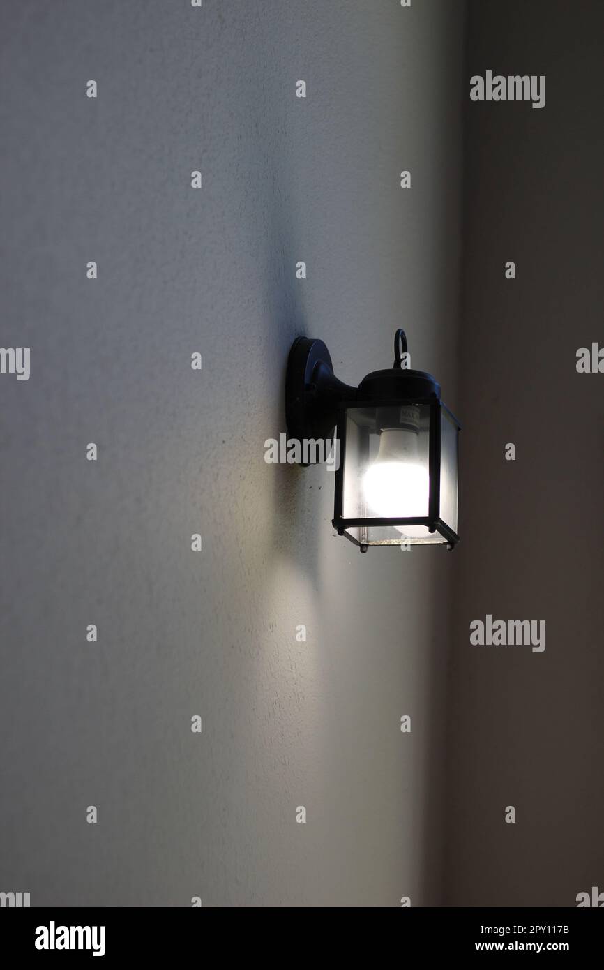 Vintage style lamp lighting a darker hallway. There's a really ...