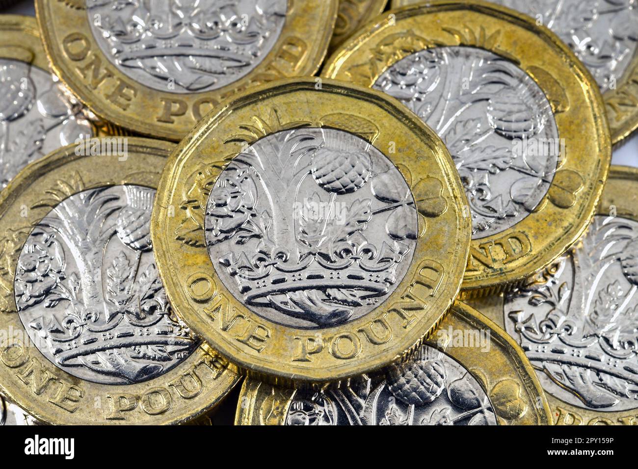 Close up view of British one pound coin on top of other coins. No ...