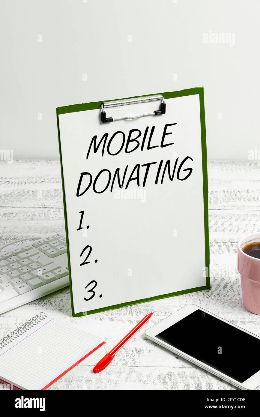 Hand writing sign Mobile Donating, Word for to give something to a ...