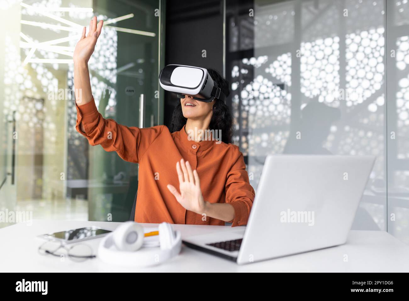 Young successful woman inside the office using vr glasses, virtual ...