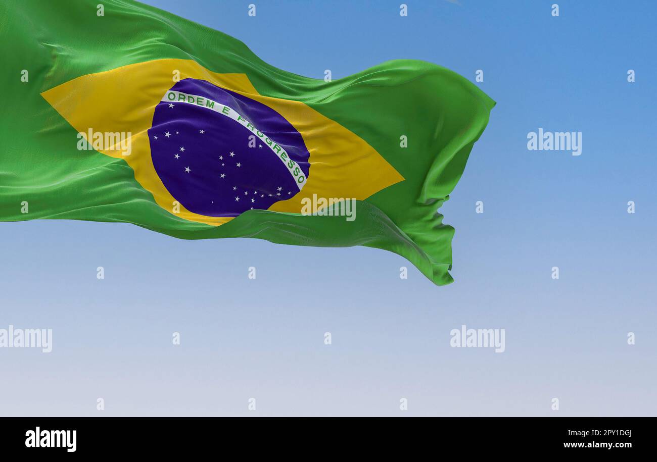 Brazil national flag waving on a clear day. Yellow diamond on green ...