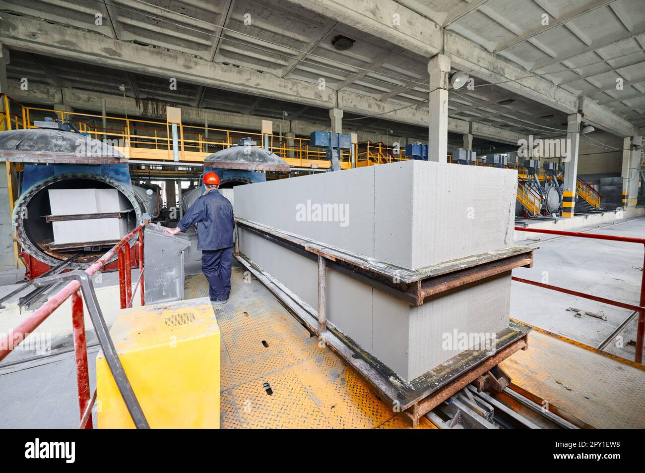 Loading of raw blocks into autoclave at manufacturing plant Stock Photo ...