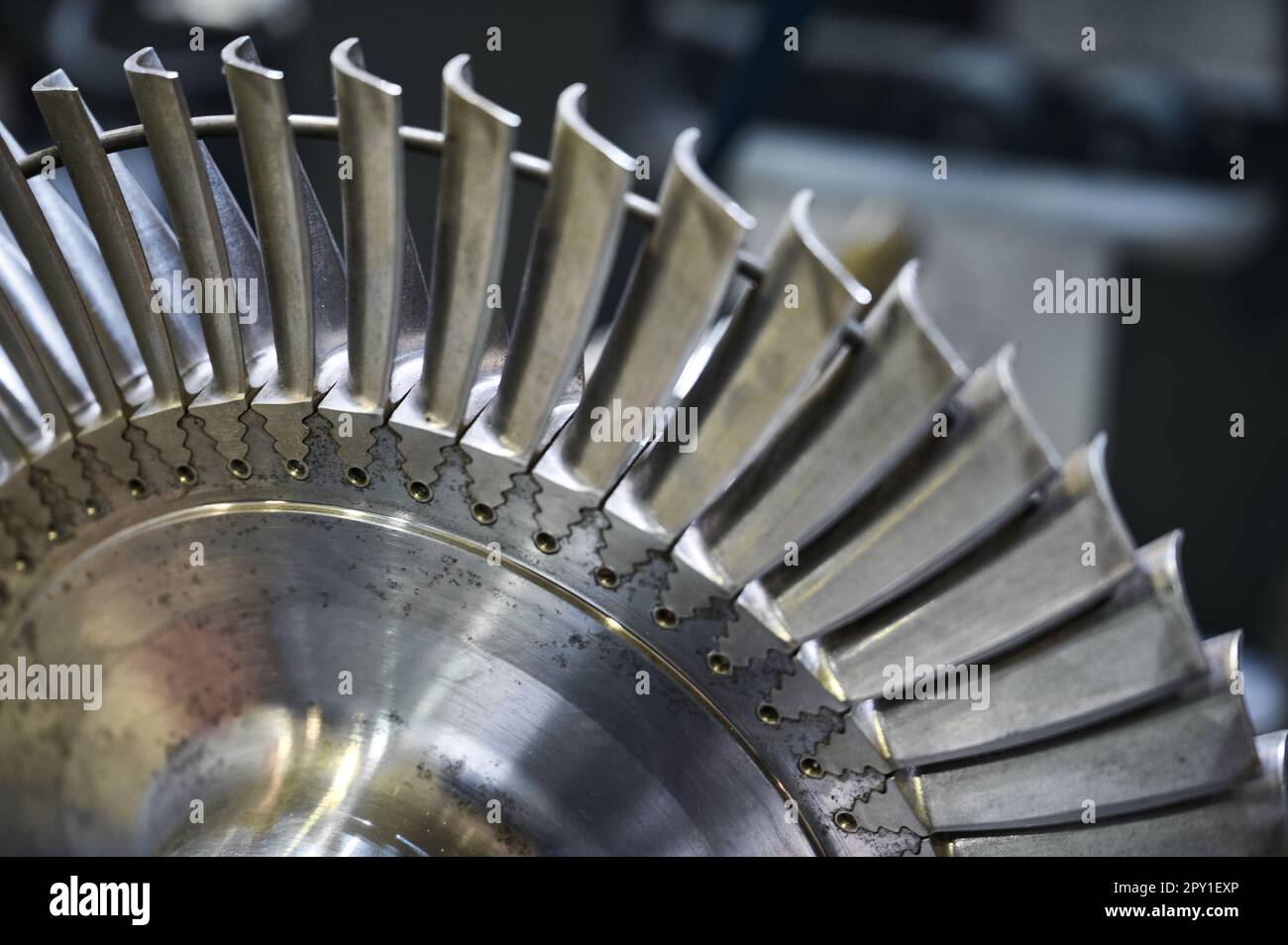 Rotor with thin blades crown on metal shaft in workshop Stock Photo - Alamy