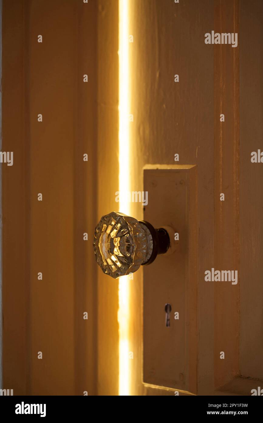 Closed door with light coming through Stock Photo - Alamy