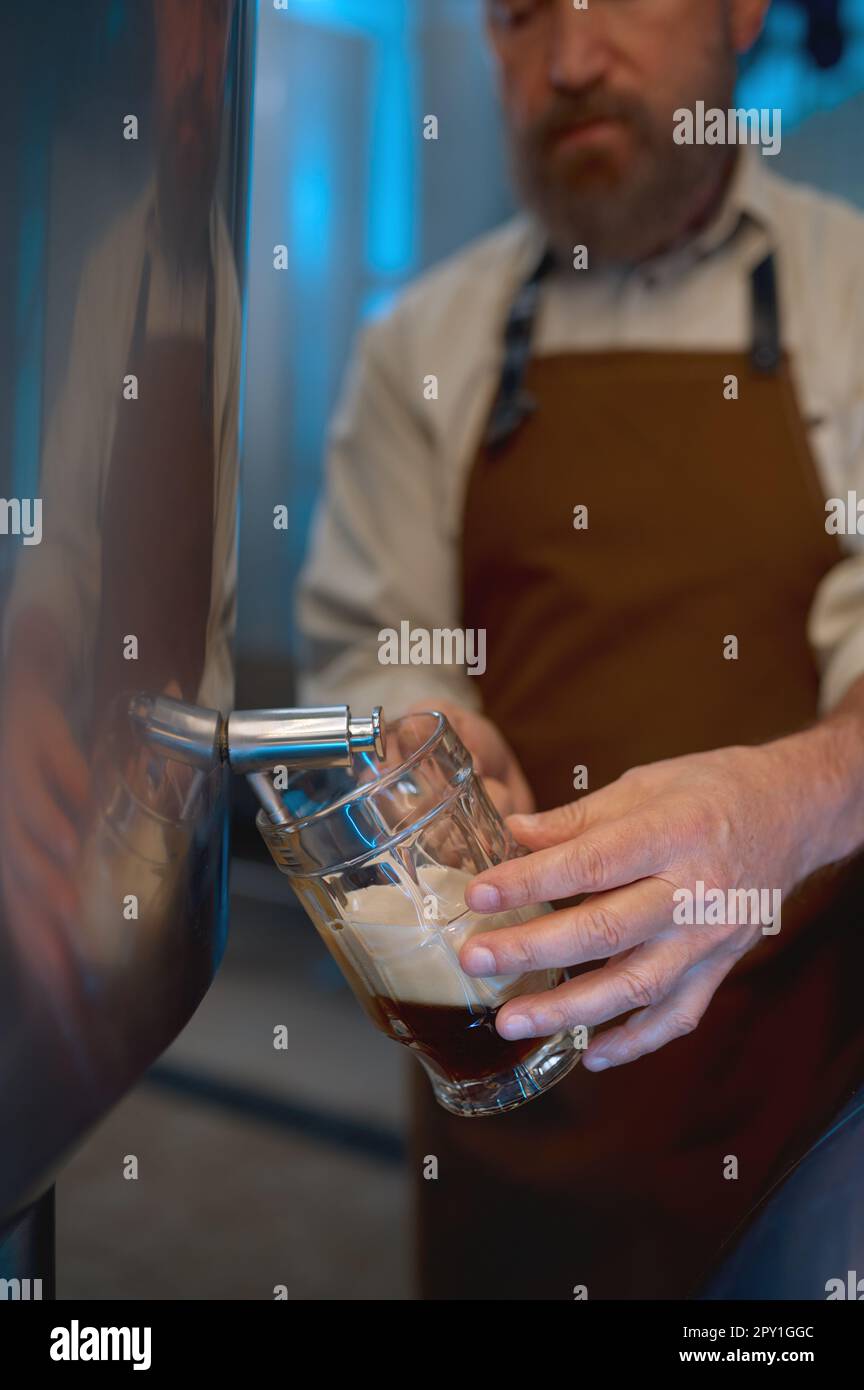 Brewery master quality tasting of craft beer at production facility ...