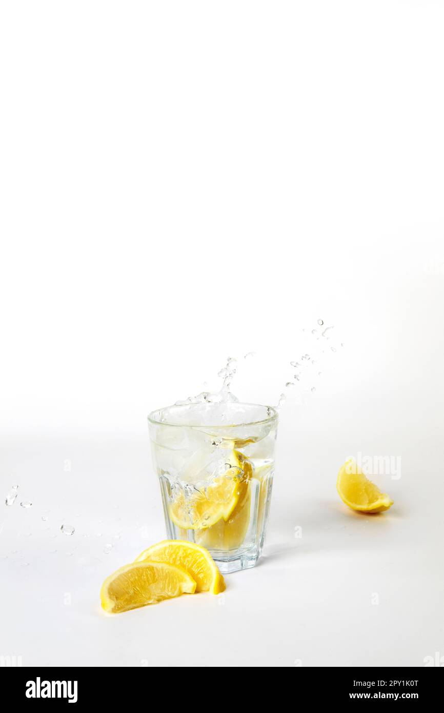 Glass of lemonade with splashing water on white background drink Fresh ...