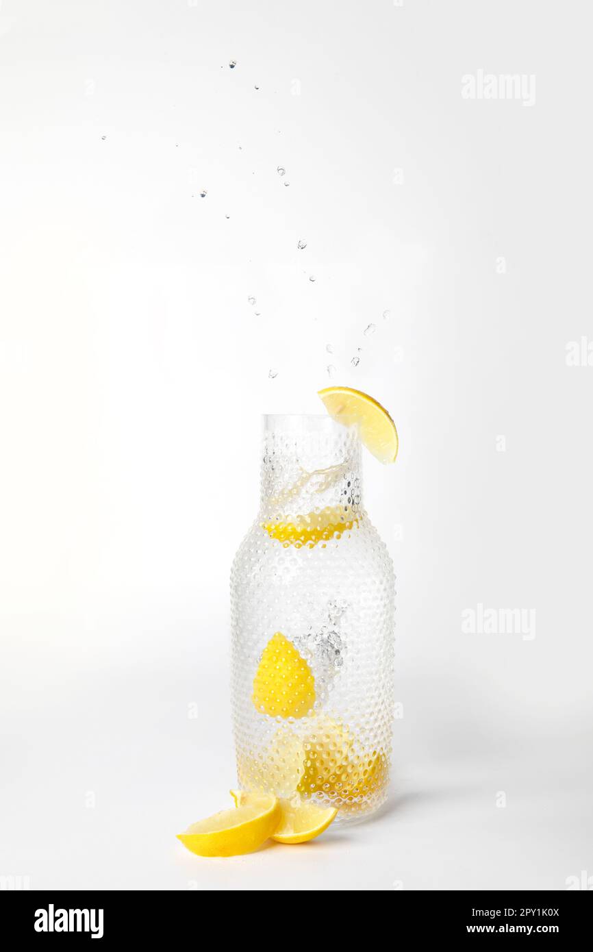 Glass of lemonade with splashing water on white background drink Stock ...