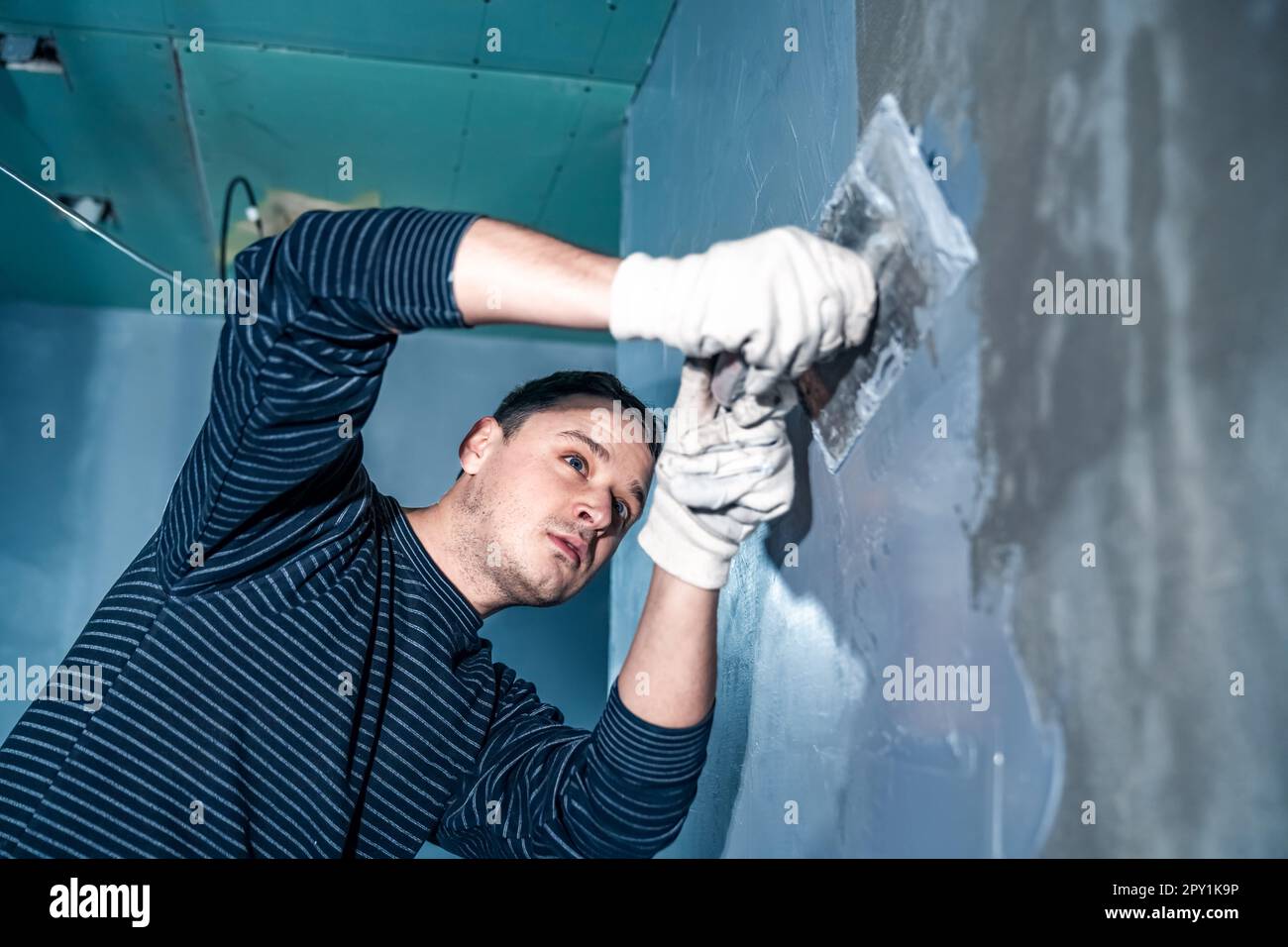 manual application of waterproofing to the wall on the construction ...