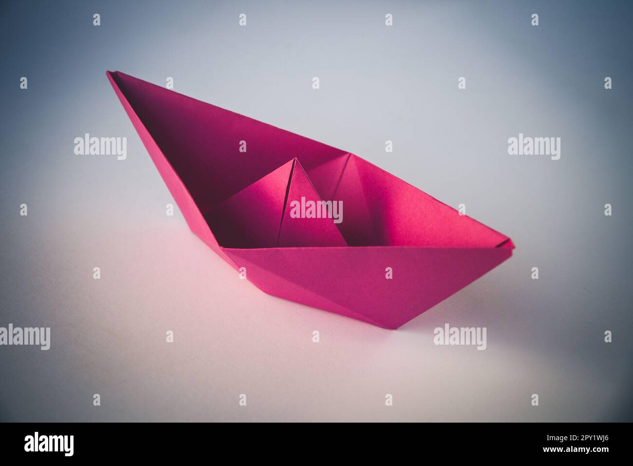 Pink paper boat origami isolated on a blank white background Stock ...