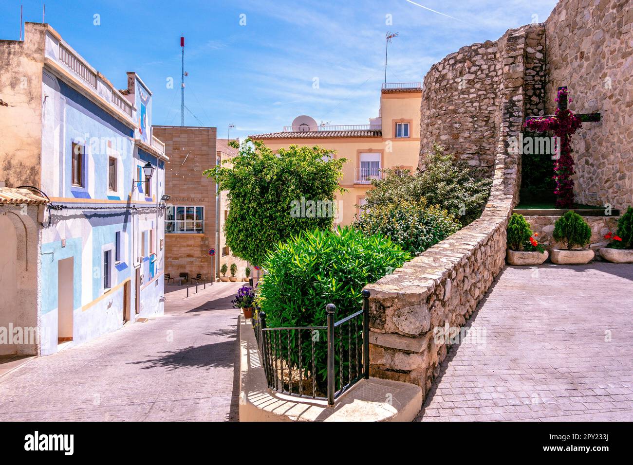 View to cozzy empty street with colorful houses in Calpe old town ...