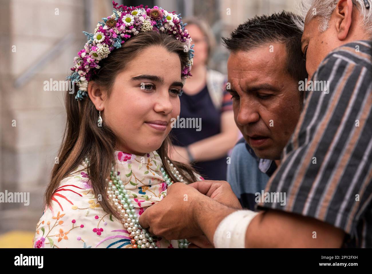 A Maya girl is prepared by two men, before being taken to the altar ...