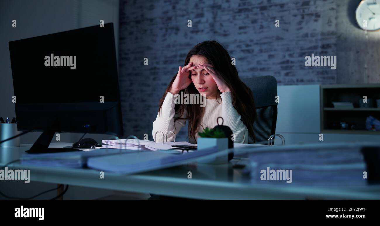 Stressed Tax Advisor With Headache. Sad Accountant Stock Photo - Alamy