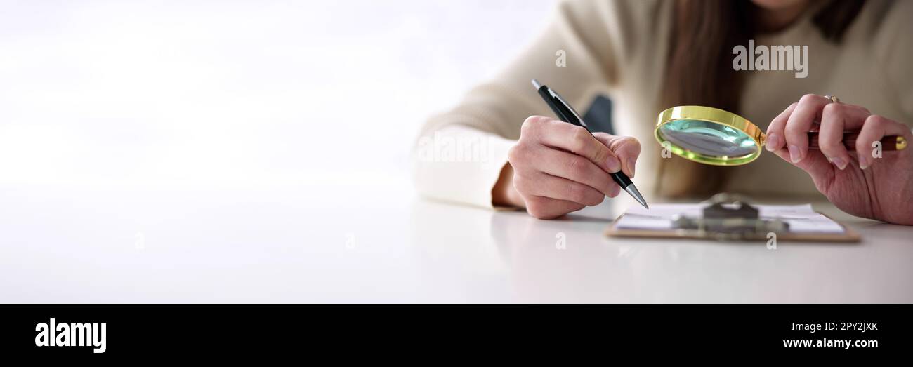 Tax Audit Document Inspection With Magnifying Glass Stock Photo - Alamy
