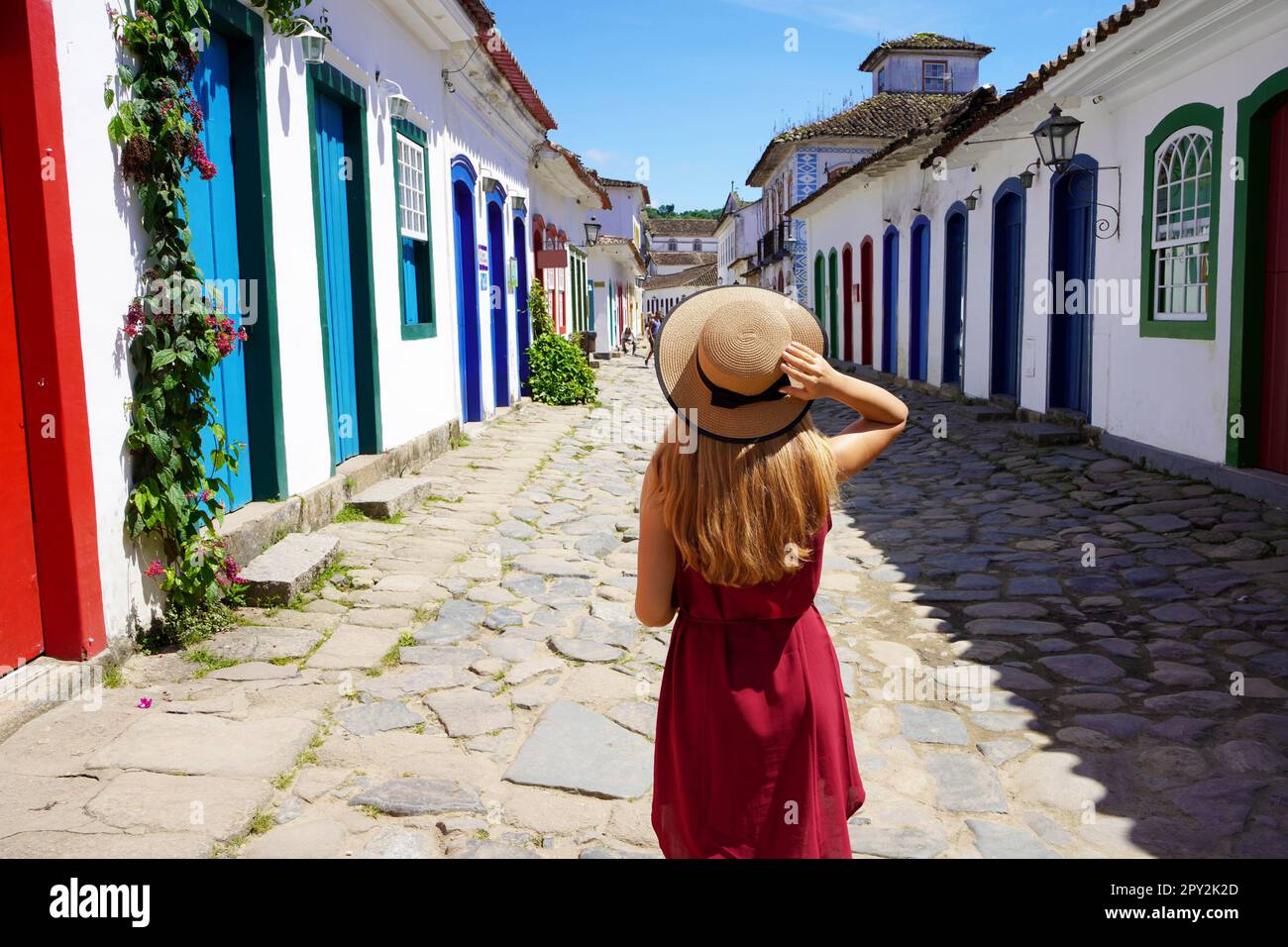 Holidays in Paraty, Brazil. Back view of beautiful fashion girl ...