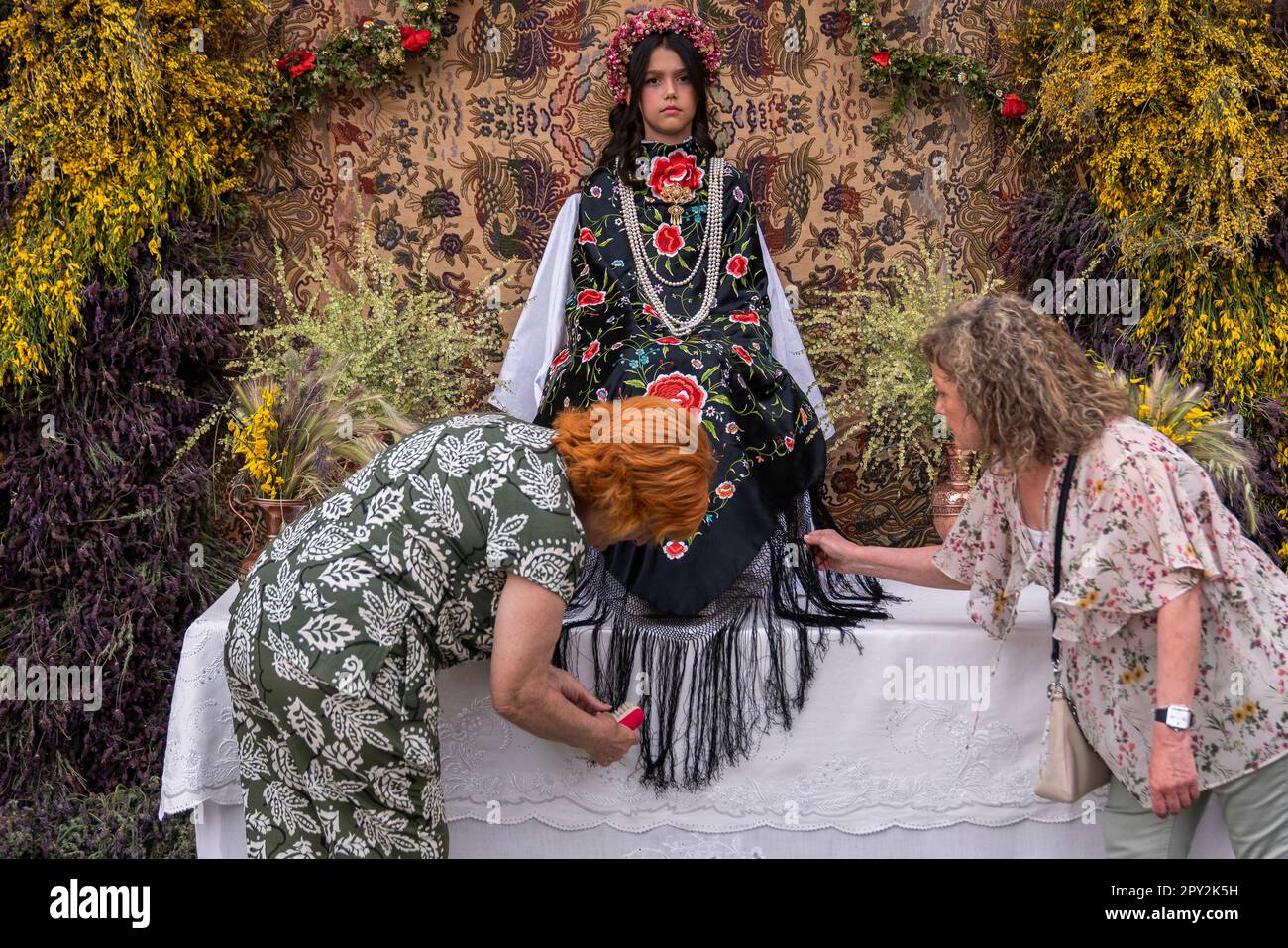 A Maya girl is been prepared in an altar during the traditional ...