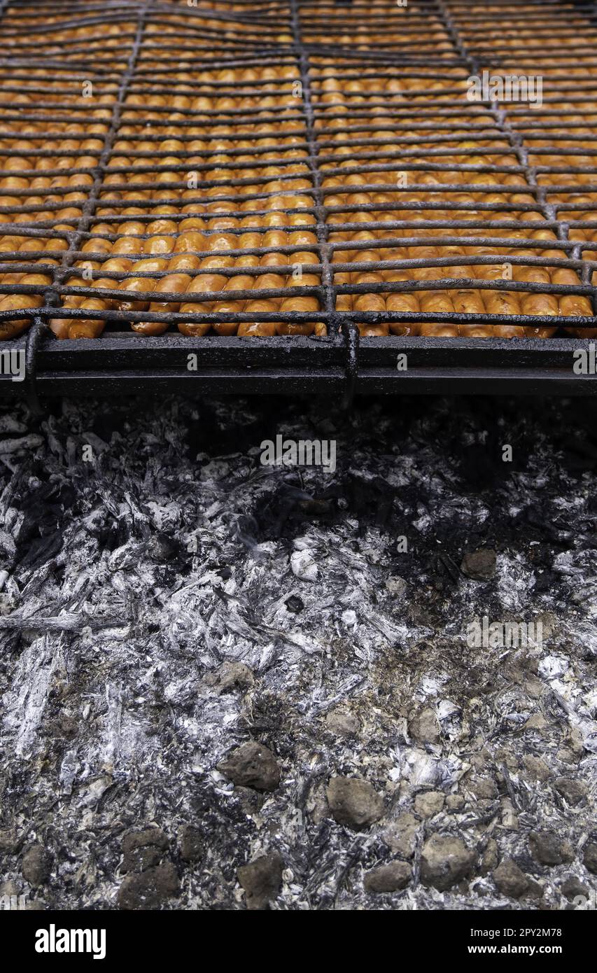 Detail of fire roasted pork, traditional festival Stock Photo - Alamy