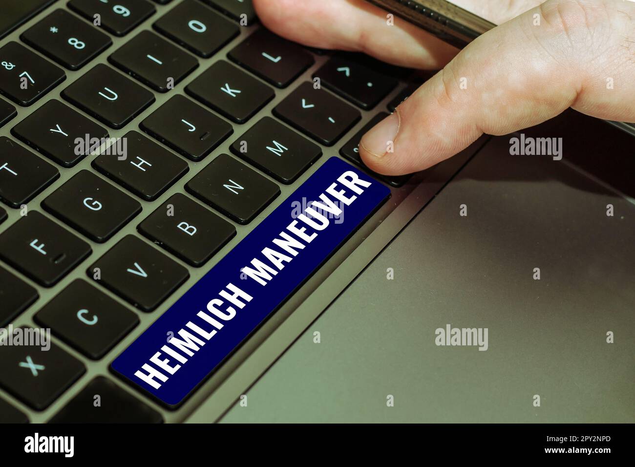 Text sign showing Heimlich Maneuver, Word Written on application of ...