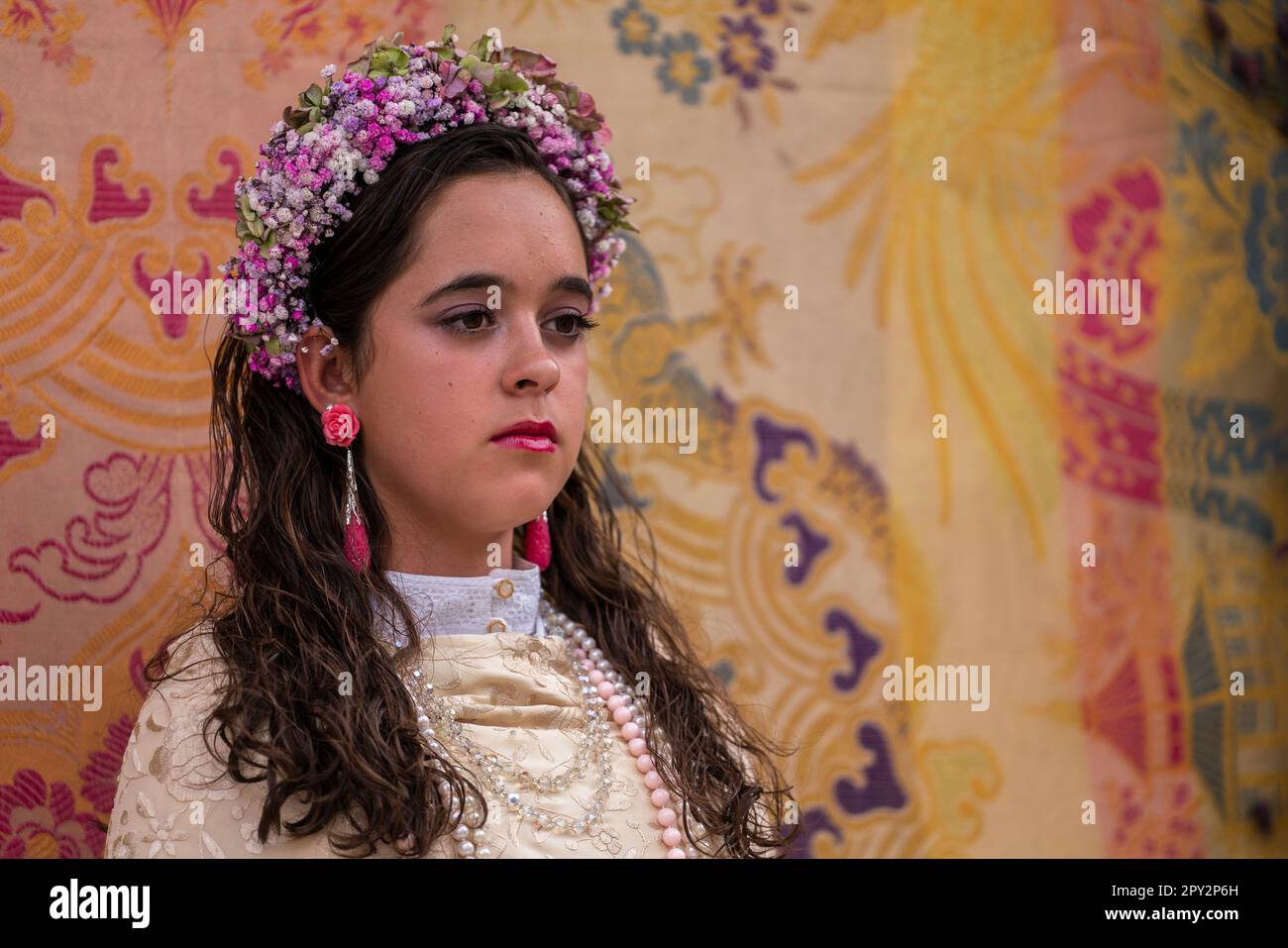 A Maya girl is seen seated at an altar during the traditional ...