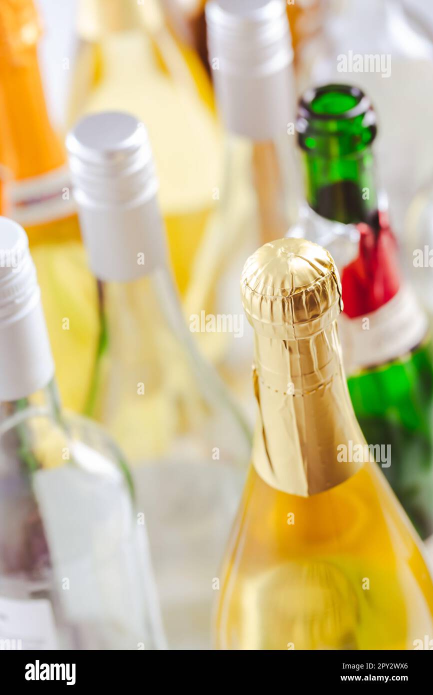 Full and empty bottles of different alcoholic drinks, abuse and alcohol ...