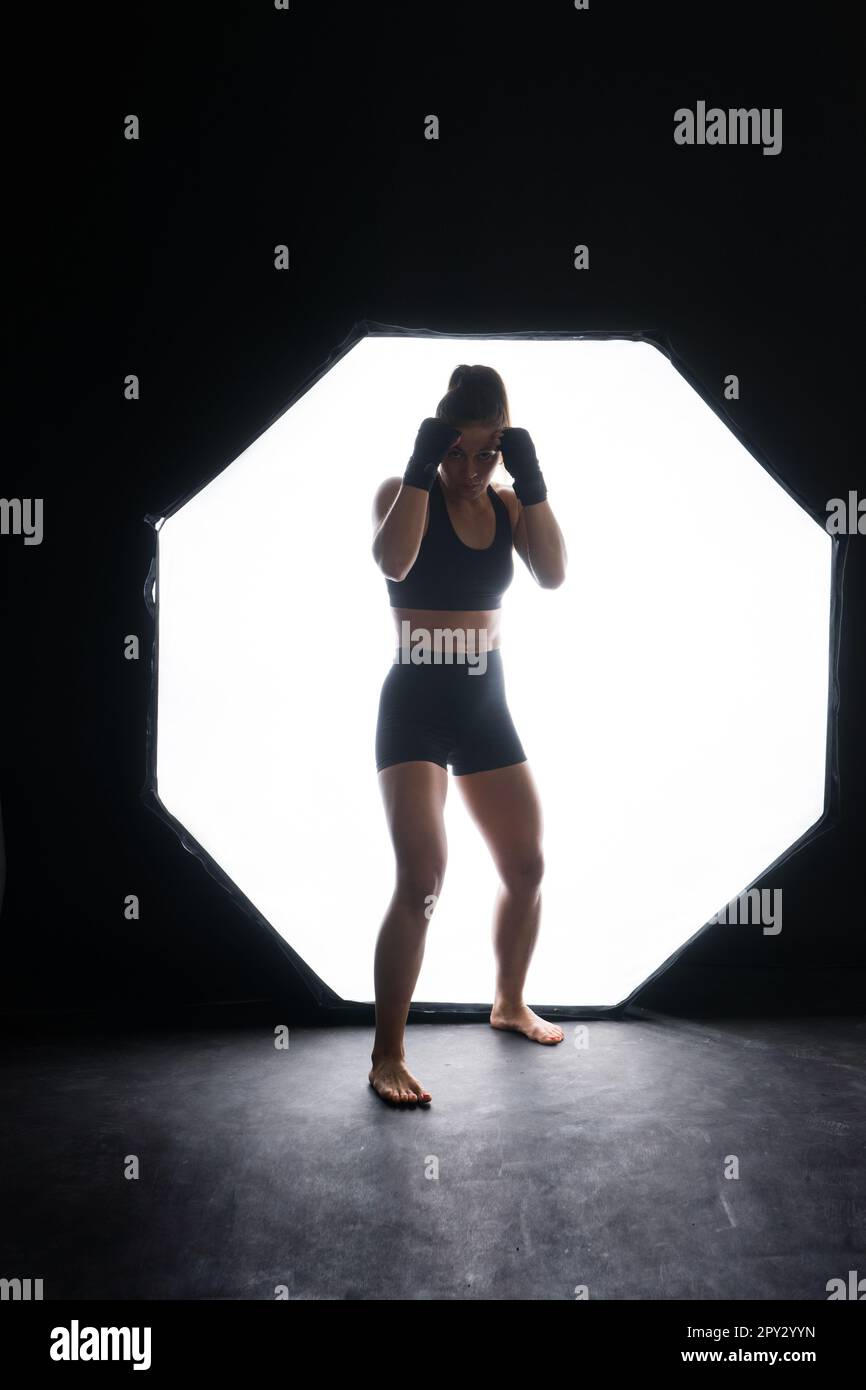 Young woman athletic female MMA fighter is training. Concept of sport ...