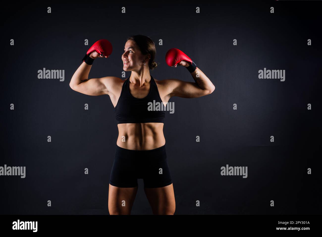 Young woman athletic female MMA fighter is training. Concept of sport ...