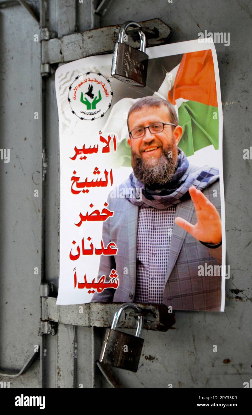 A portrait of the late Palestinian prisoner Khader Adnan seen hanging ...