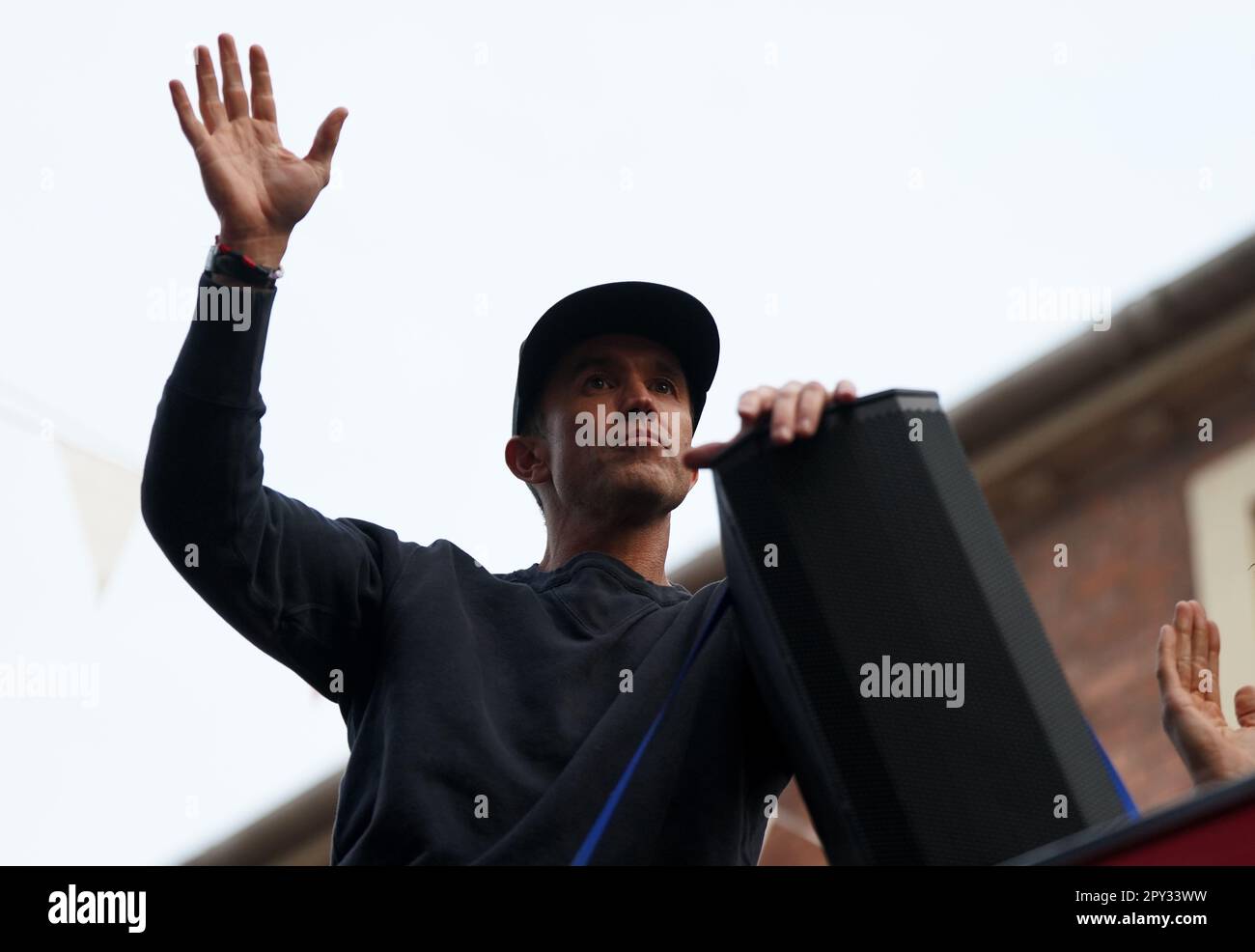 Wrexham co-owner Rob McElhenney celebrates on an open-top bus during a ...