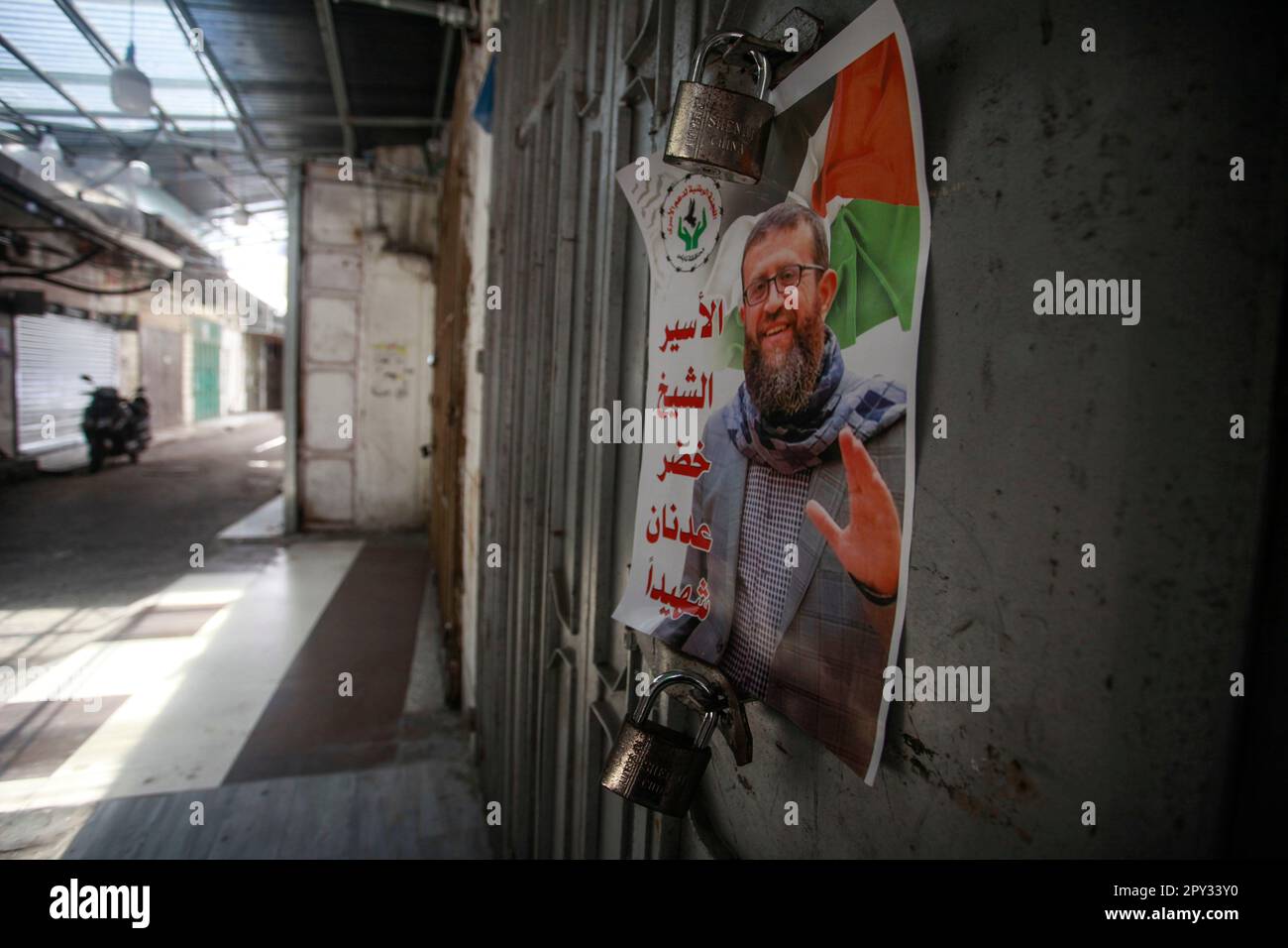 A portrait of the late Palestinian prisoner Khader Adnan seen hanging ...