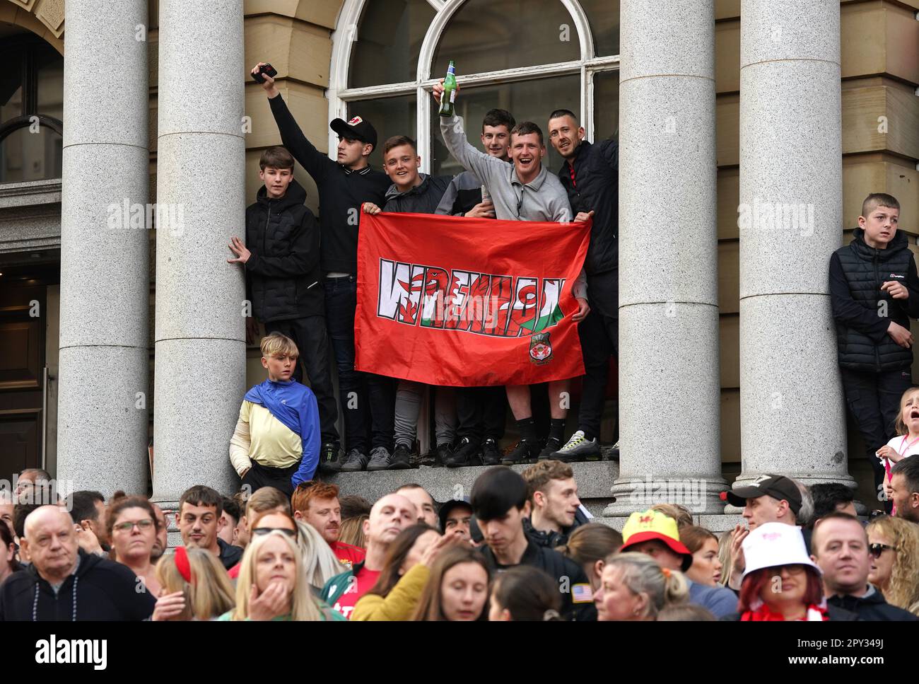 Wrexham fans celebrate during a victory parade in Wrexham, Wales ...