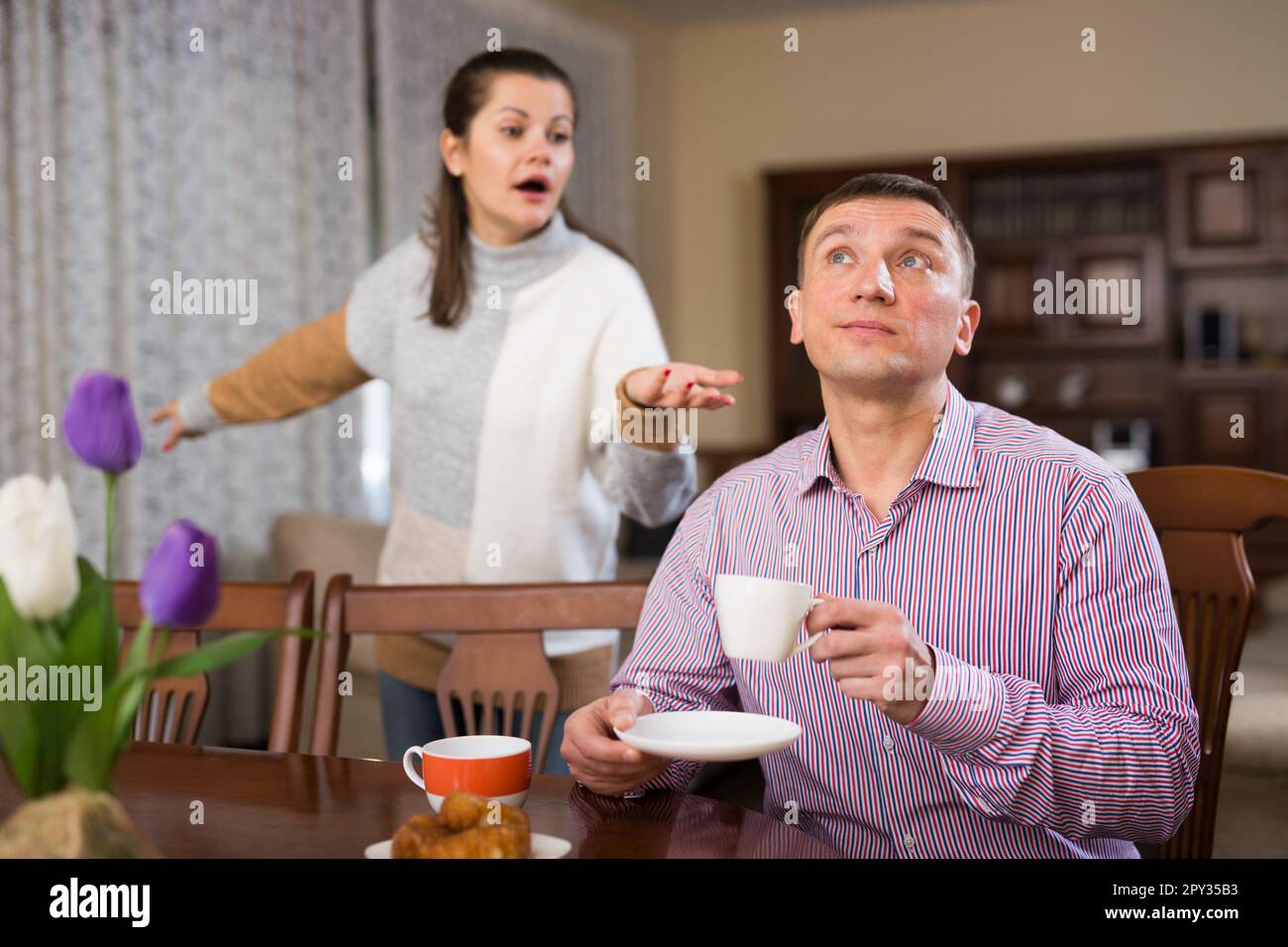 Woman scolding her husband Stock Photo - Alamy