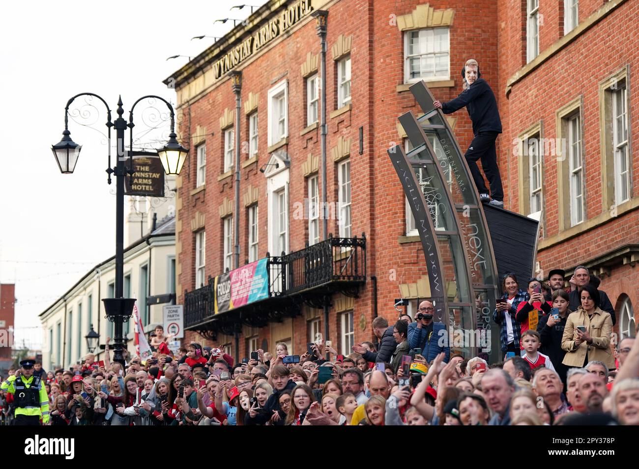 Wrexham fans celebrate during a victory parade in Wrexham, Wales ...