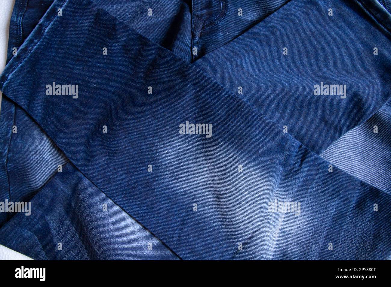 folded blue jeans pant pattern texture background Stock Photo - Alamy