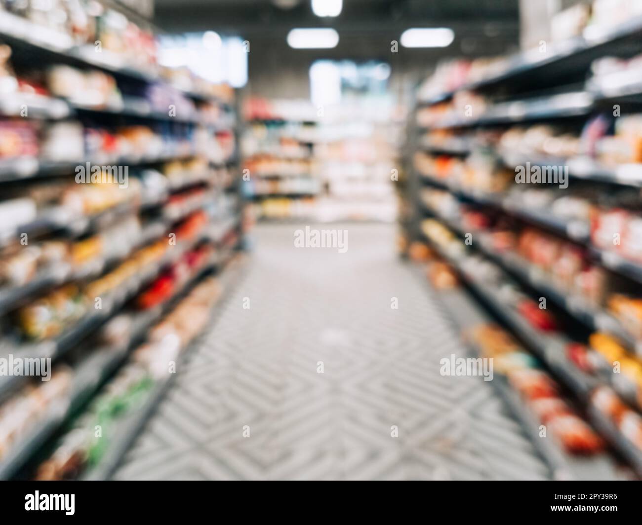 Abstract blurred supermarket aisle with colorful shelves as background ...
