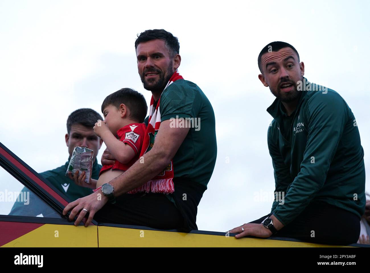 Wrexham goalkeeper Ben Foster on an open-top bus during a victory ...