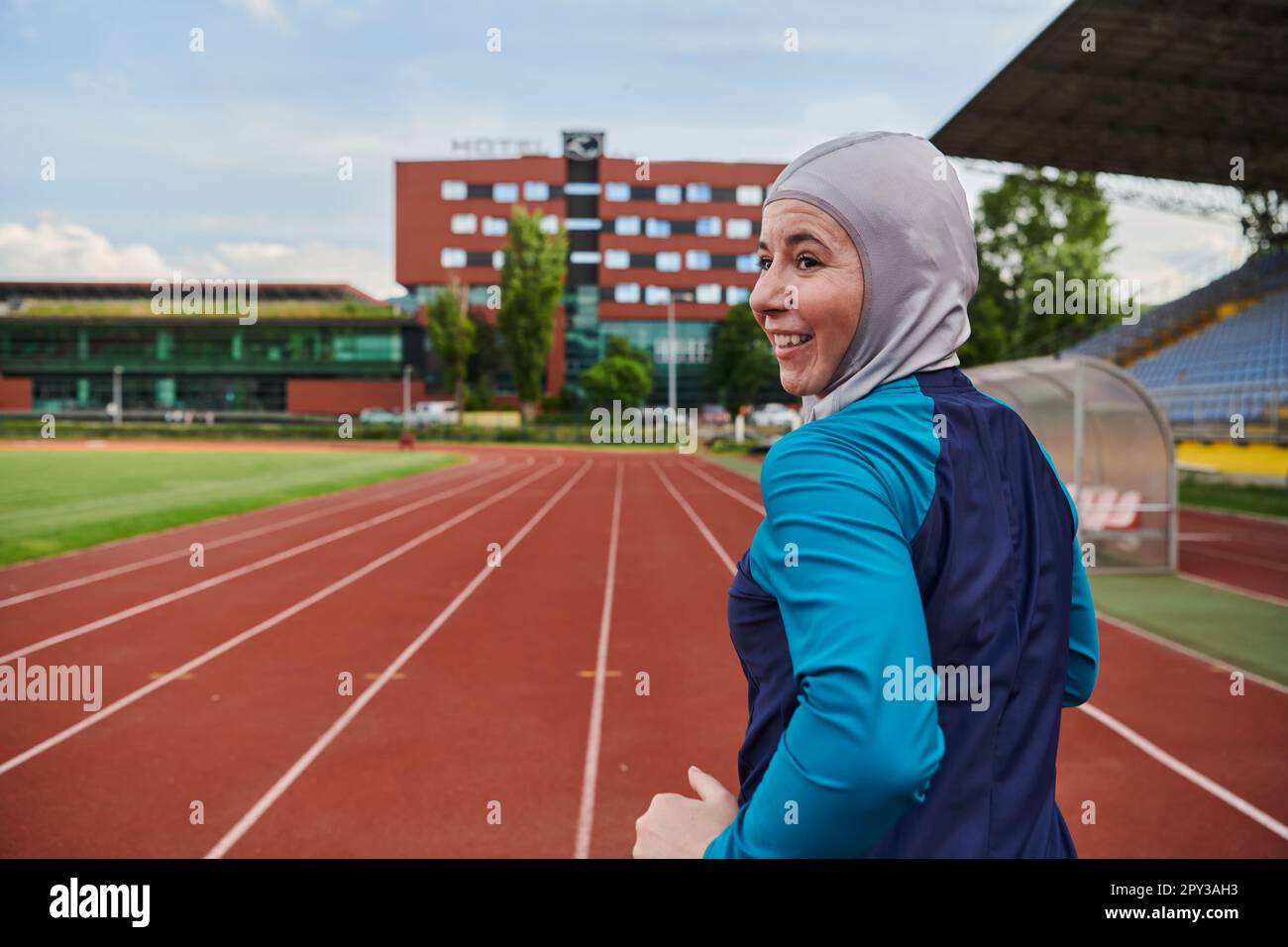 A muslim woman in a burqa sports muslim clothes running on a marathon ...