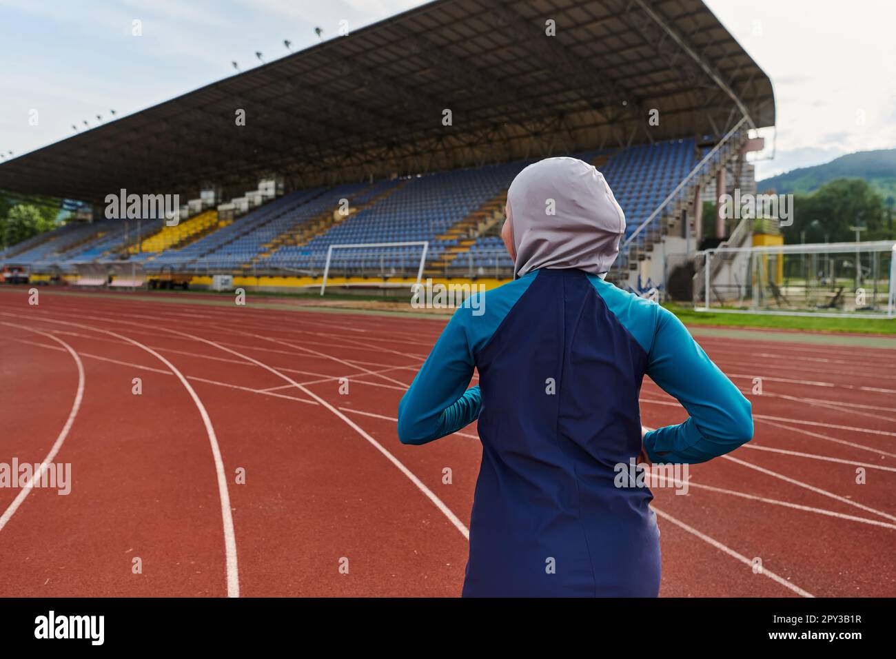 A muslim woman in a burqa sports muslim clothes running on a marathon ...