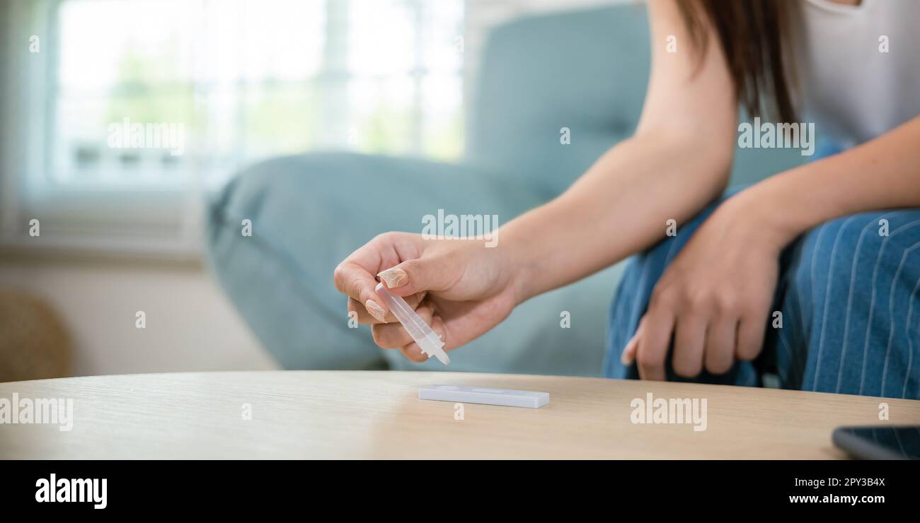Close up woman hands using rapid antigen test kit for selftest, female ...