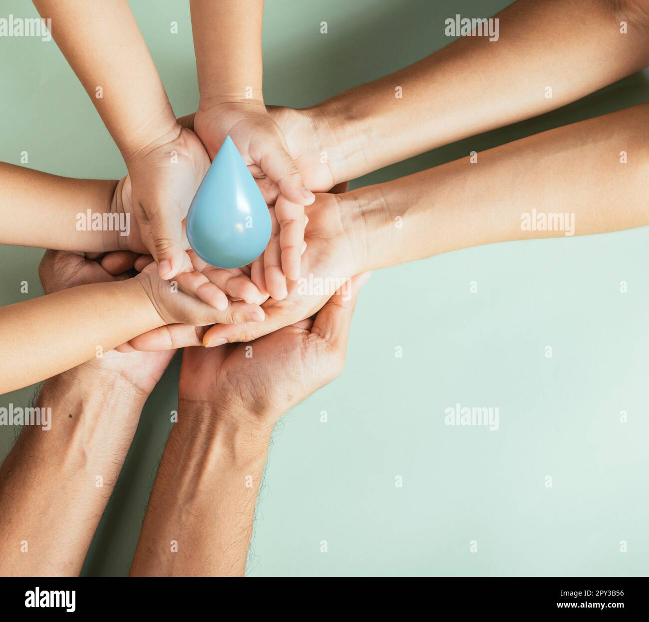 Hands of family holding 3D blue water drop, father mother and child ...