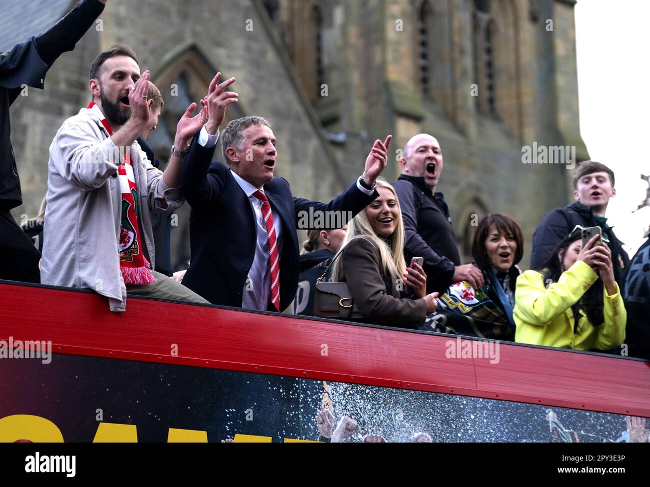 Wrexham manager Phil Parkinson (second left) celebrating on an open-top ...