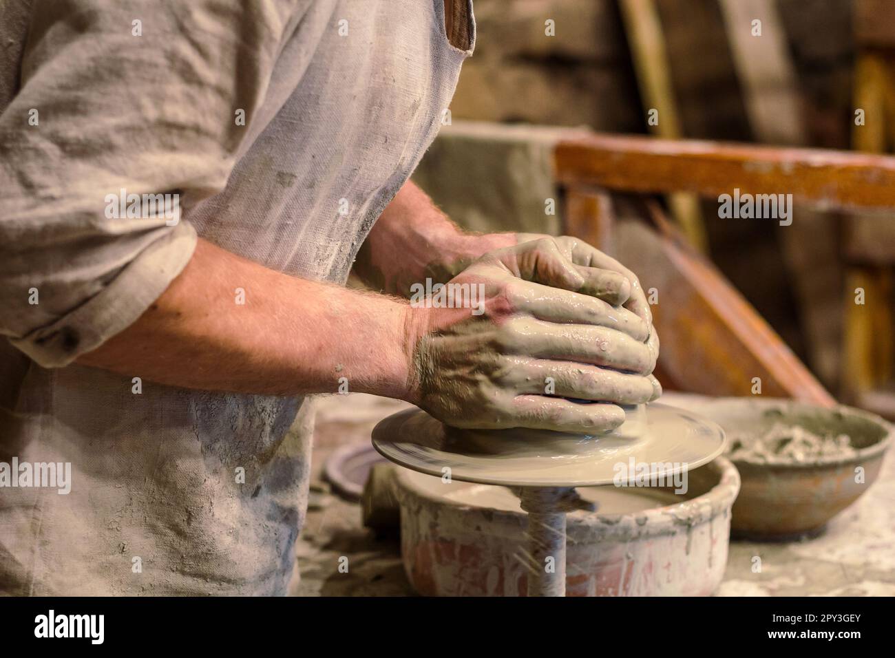 Close up pottery wheel lesson concept photo. Sculpting skill. Ceramics ...