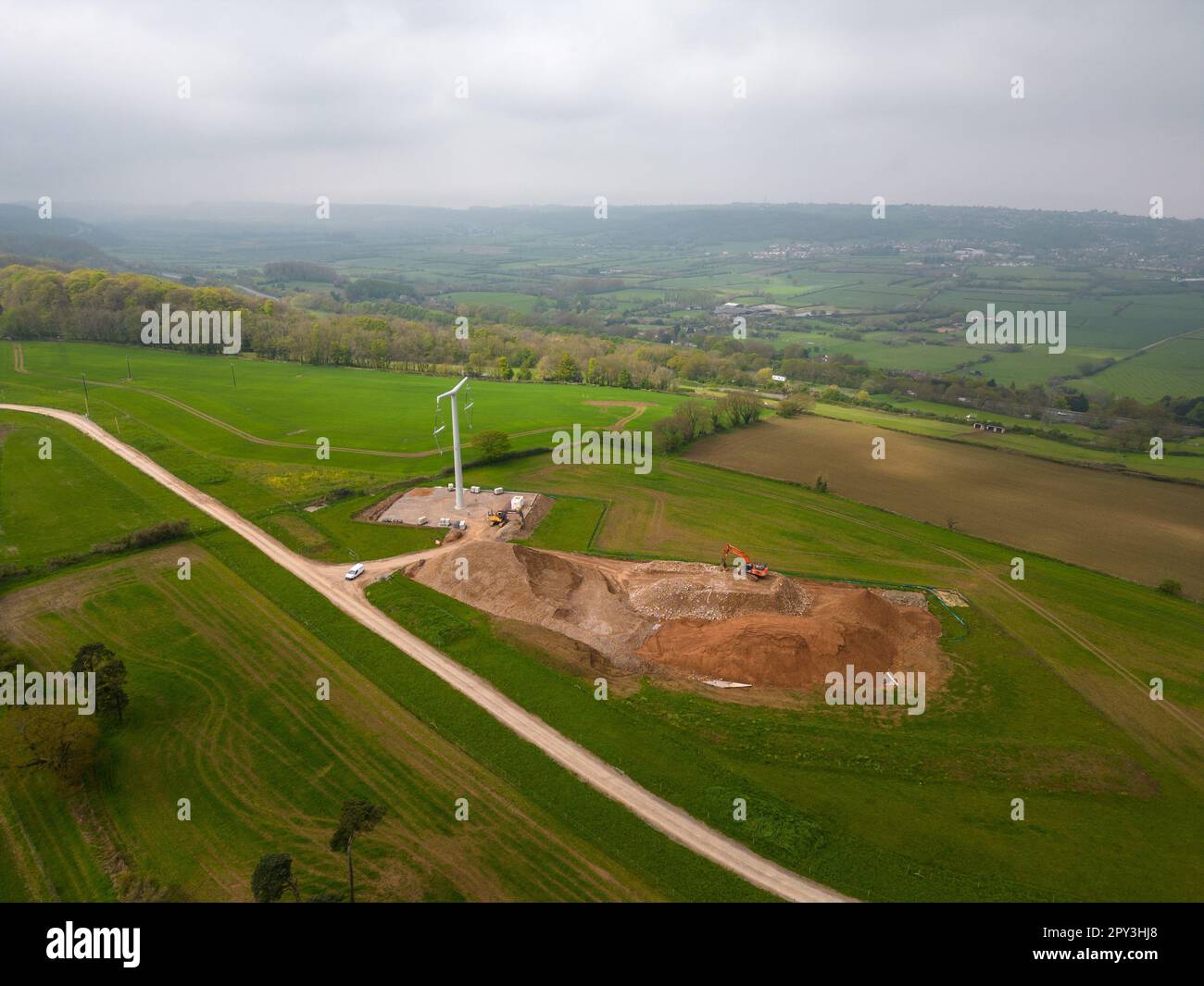 An aerial view of a vast expanse of land with T-pylons to connect a ...