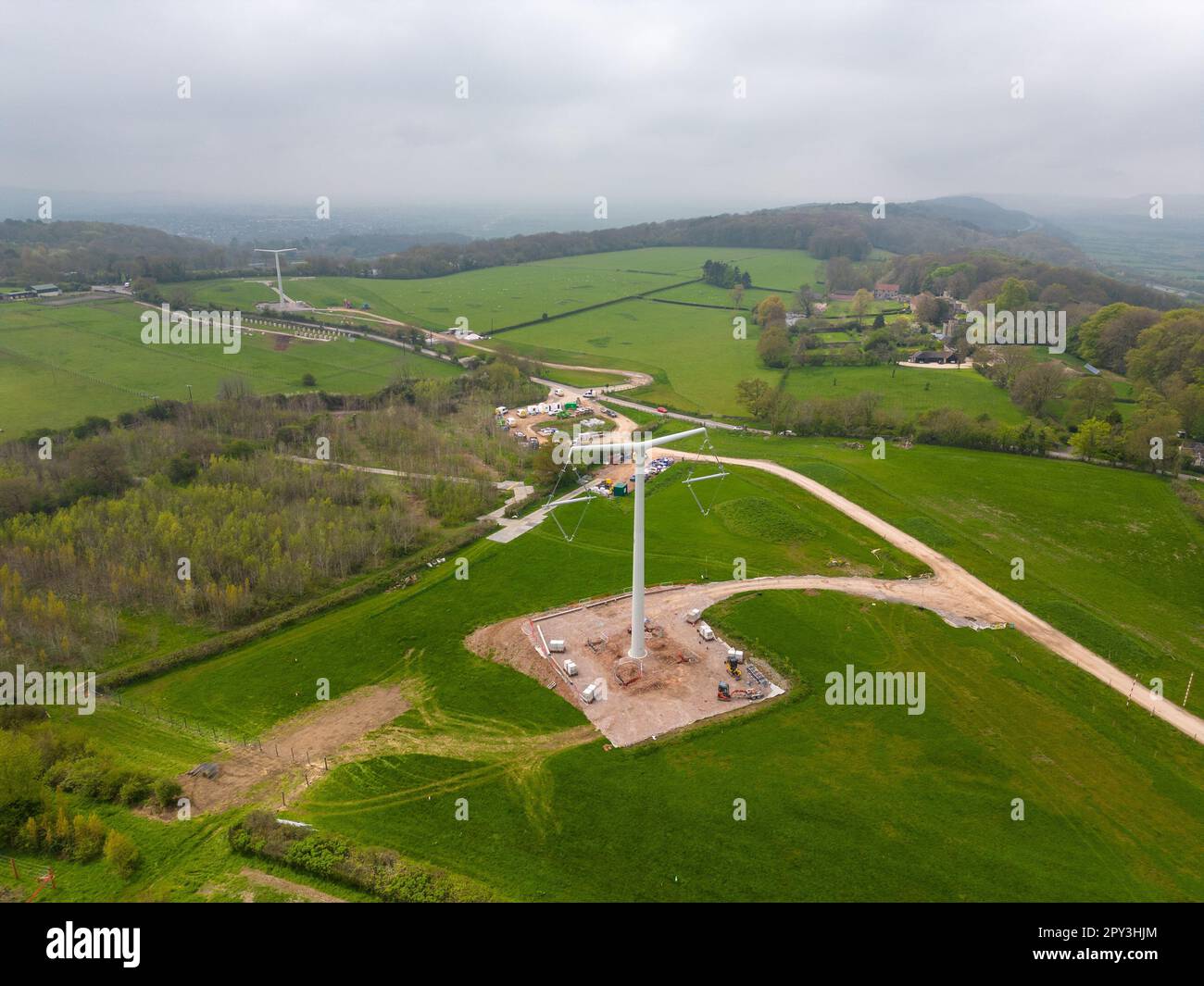 An aerial view of a vast expanse of land with T-pylons to connect a ...
