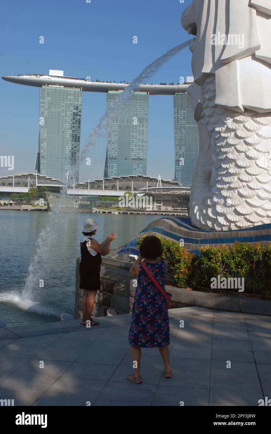 The Merlion Statue on the Esplanade with Marina Bay Sands Hotel in the ...