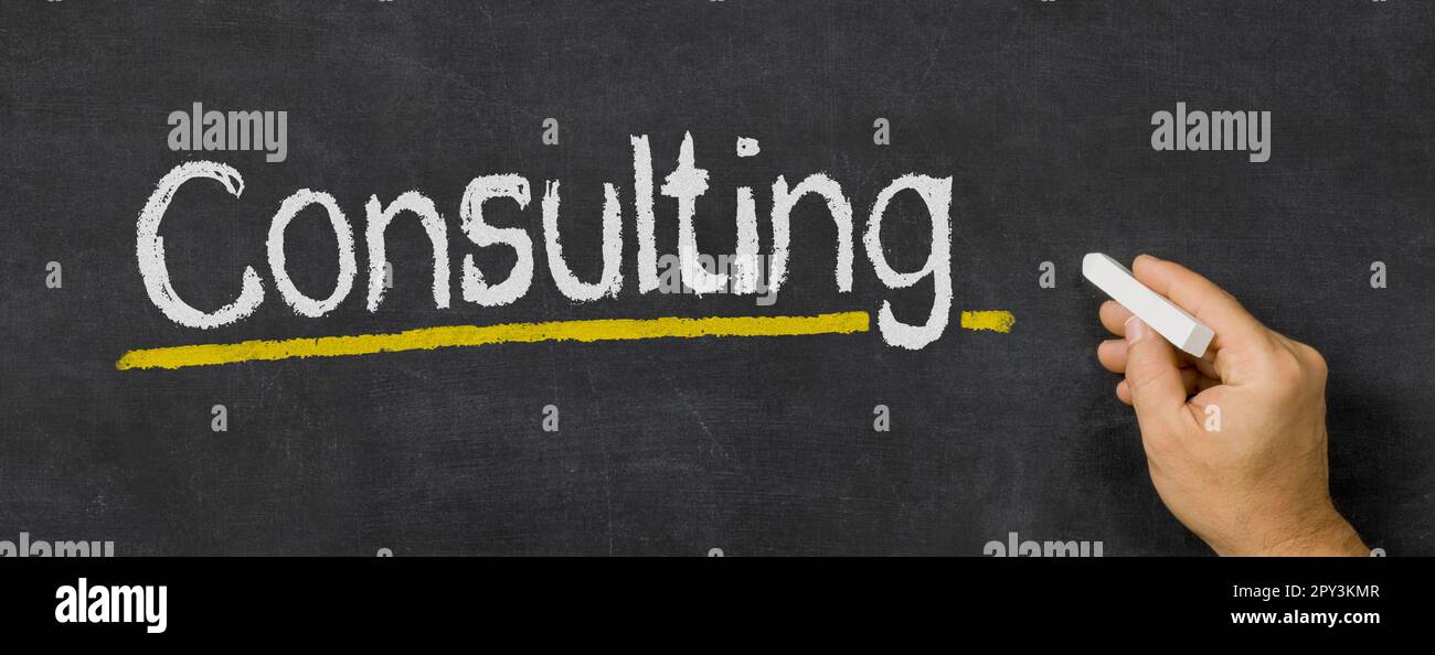 Text written on a blackboard - Consulting Stock Photo - Alamy