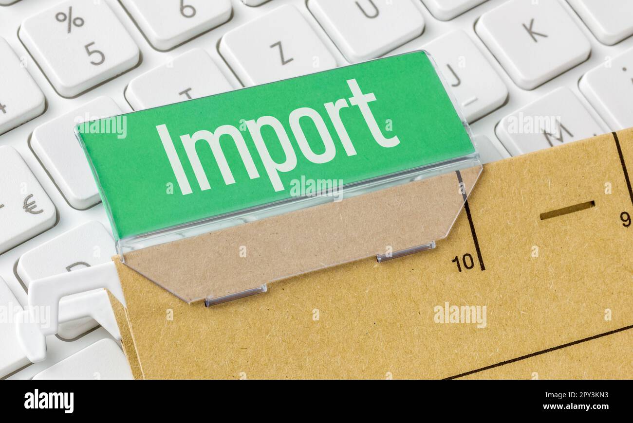 A brown file folder labeled Import Stock Photo - Alamy