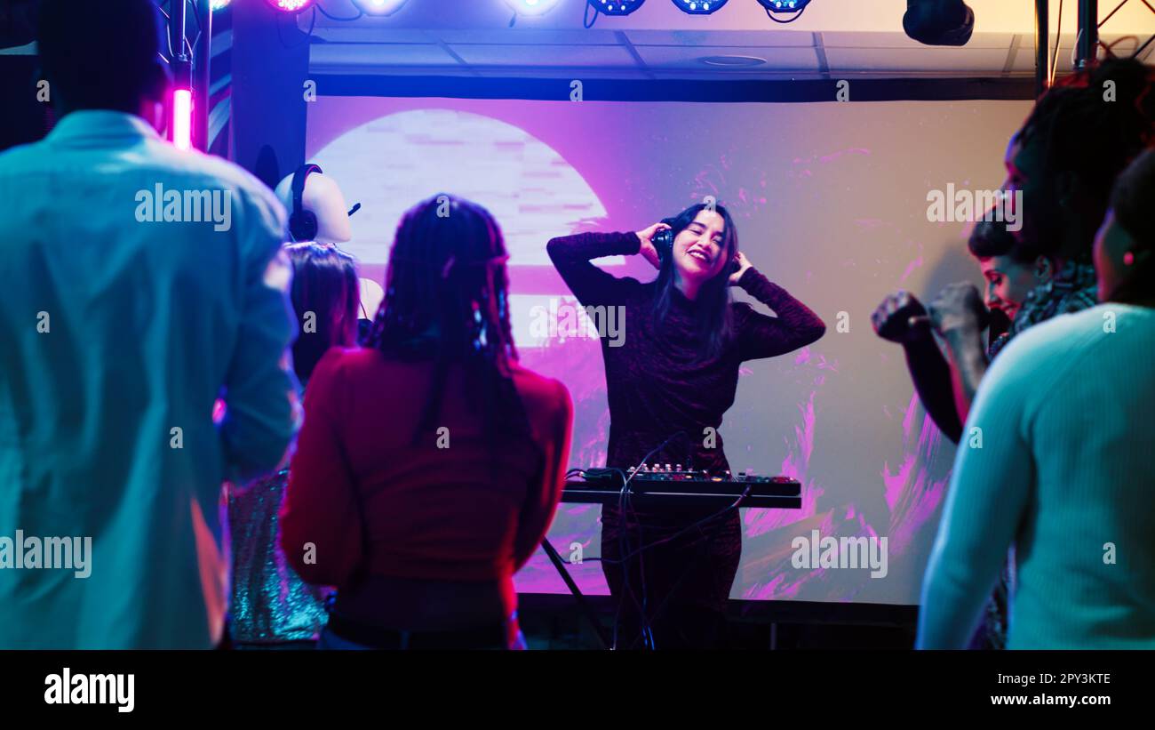 Diverse friends partying at nightclub, having fun together with live ...