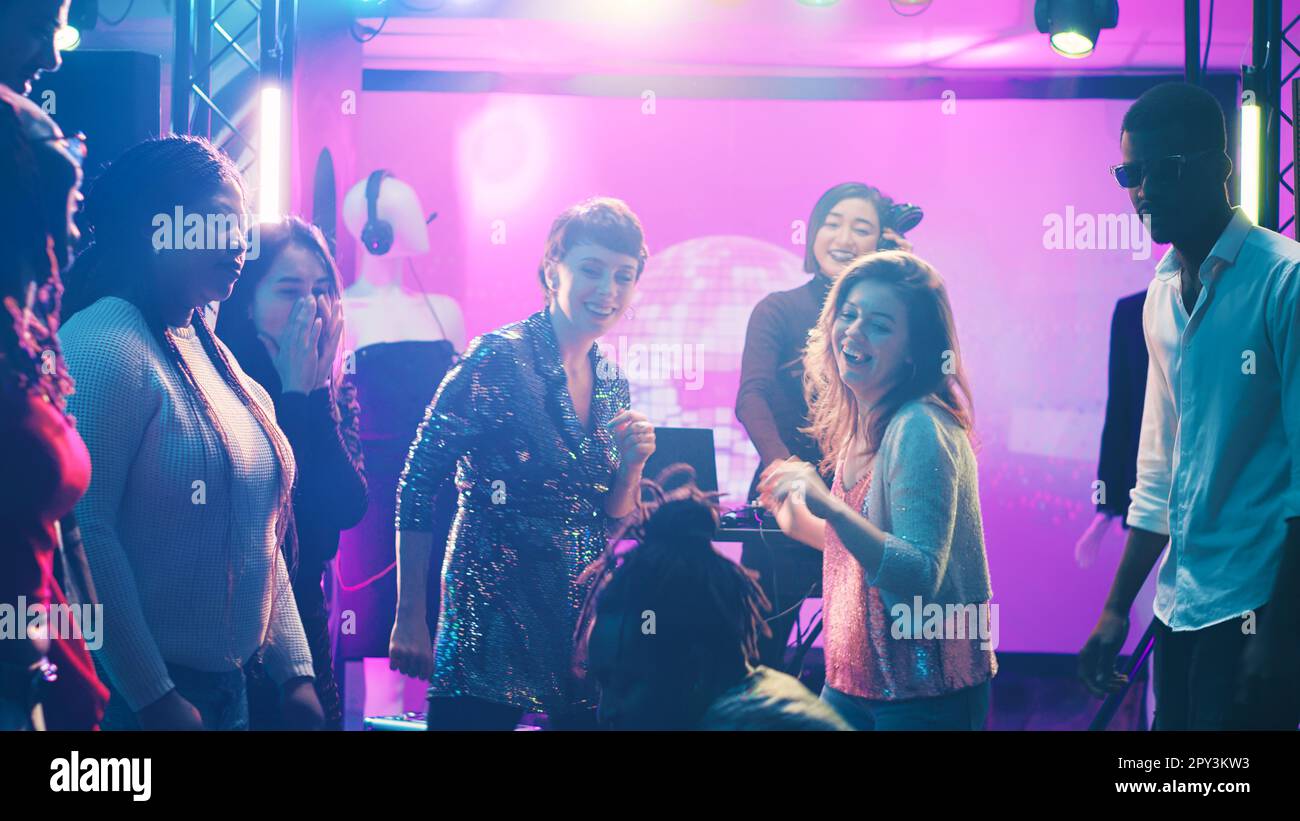 Cool people doing dance moves at club, dancing on electronic music in ...