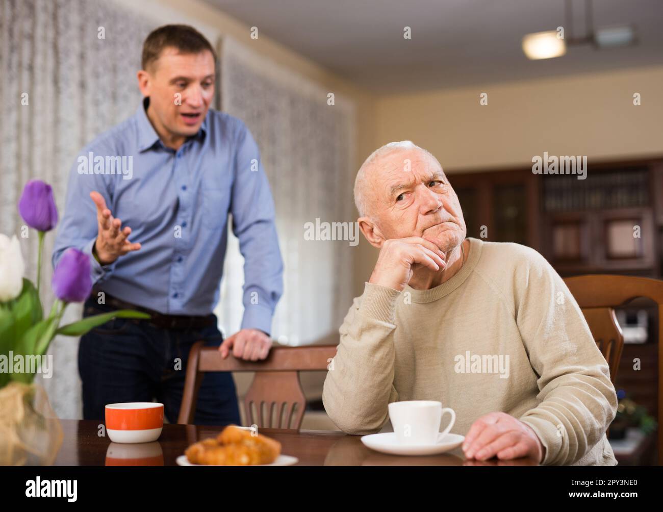Father talking offended son in hi-res stock photography and images - Alamy