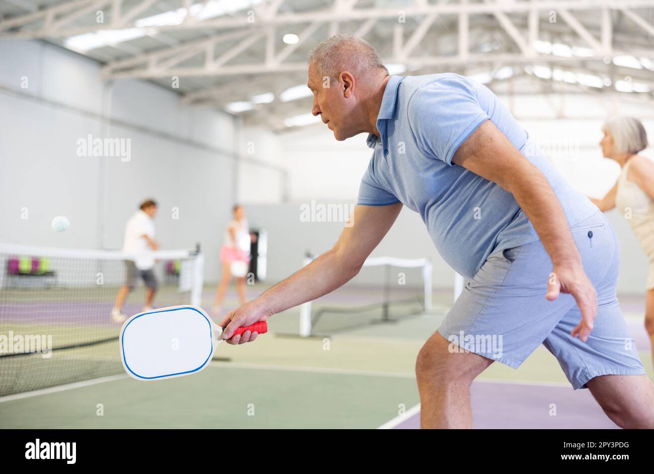 Playing indoor pickleball court hi-res stock photography and images - Alamy