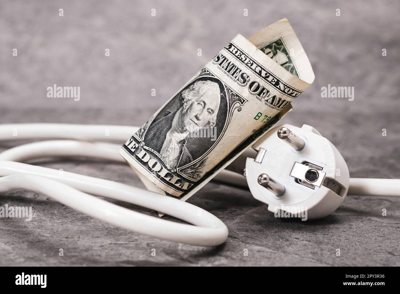 White electric plug and one dollar banknote close-up. Concept of ...